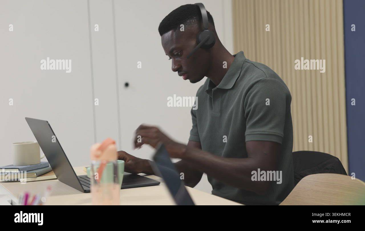 Call center operator working on laptop Stock Video Footage - Alamy