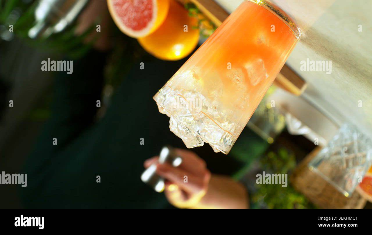 Refreshing cocktail with ice being poured in glass Stock Video Footage ...