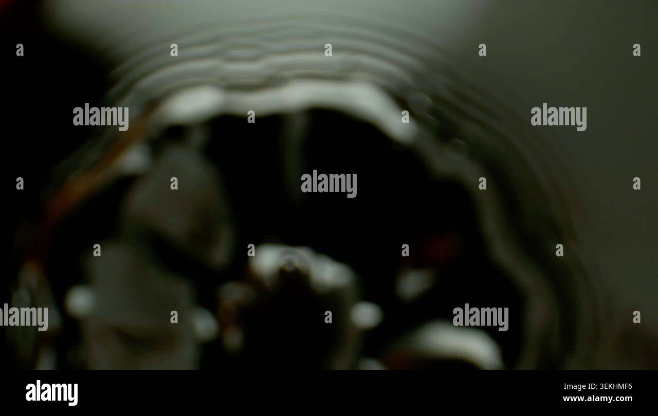 Water ripples create circles in dark space Stock Video Footage - Alamy