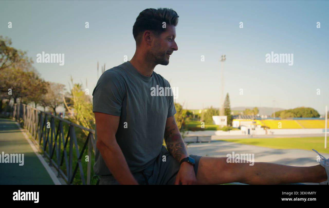 Man stretching leg Stock Video Footage - Alamy