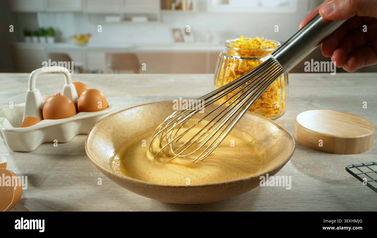 Mixing eggs and ingredients in a bowl Stock Video Footage - Alamy