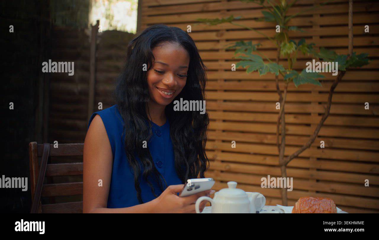 Smiling Woman Using Phone at Outdoor Breakfast Table Stock Video ...