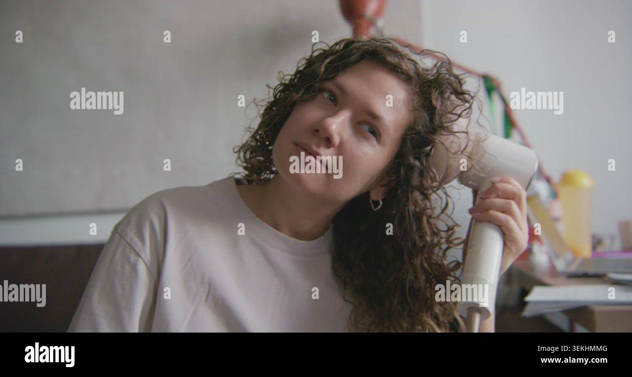 Person with curly hair using a diffuser hair dryer Stock Video Footage ...