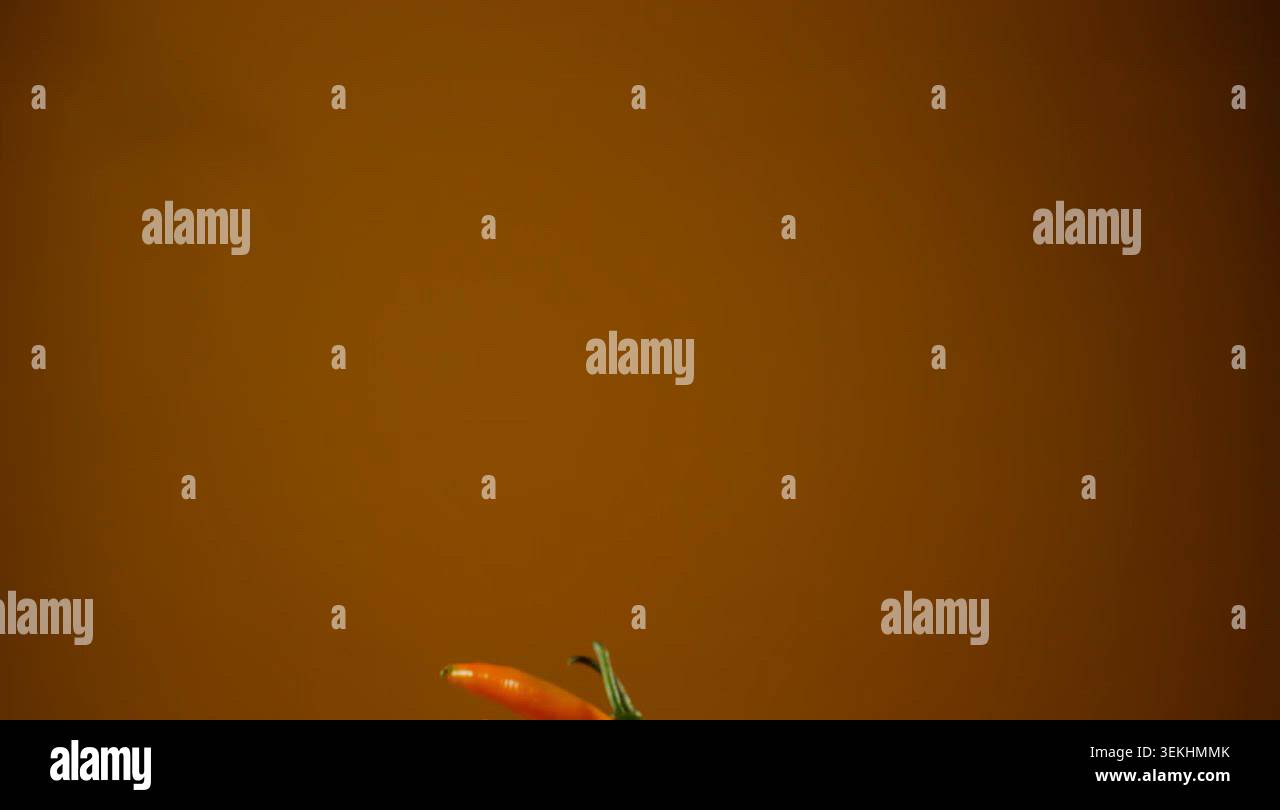 Chilies flying in the air during preparation Stock Video Footage - Alamy