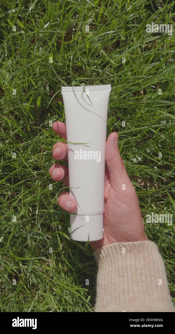 Hand Holding Blank White Lotion Bottle Outdoors Nature Stock Video ...