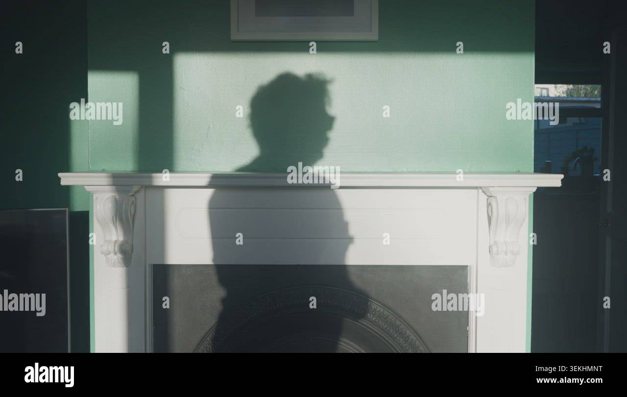 Shadows Cast in a Room of a Man whom is cleaning his Glasses Stock ...