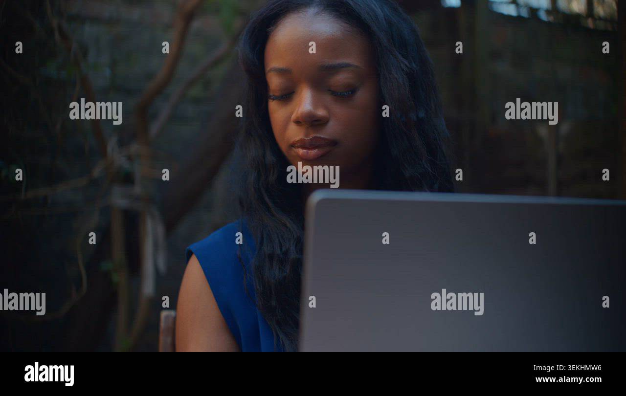 Woman texting momentarily while working on her laptop Stock Video ...