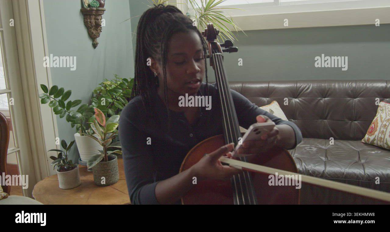 Cellist Checks Phone Stock Video Footage - Alamy