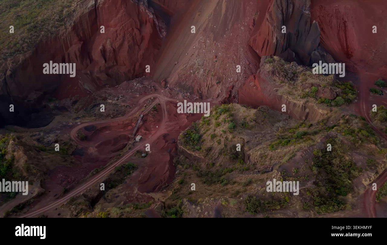 Red Hills and Dirt Roads Seen From High Above During Daylight Hours ...