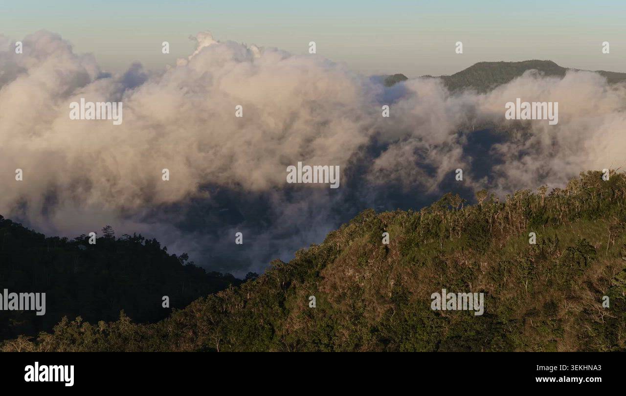 Dramatic clouds rolling over tropical mountain ridge Stock Video ...