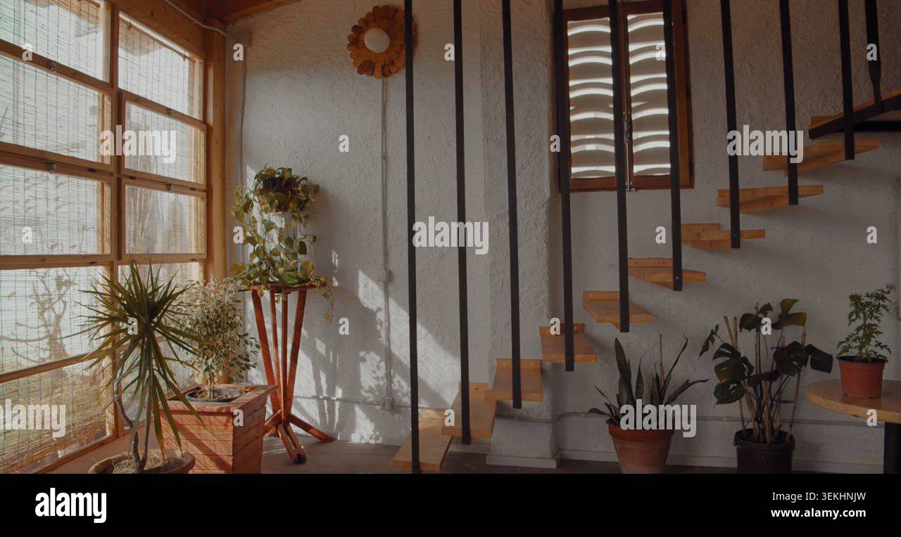 Sunlit wooden interior with floating Stairs Stock Video Footage - Alamy
