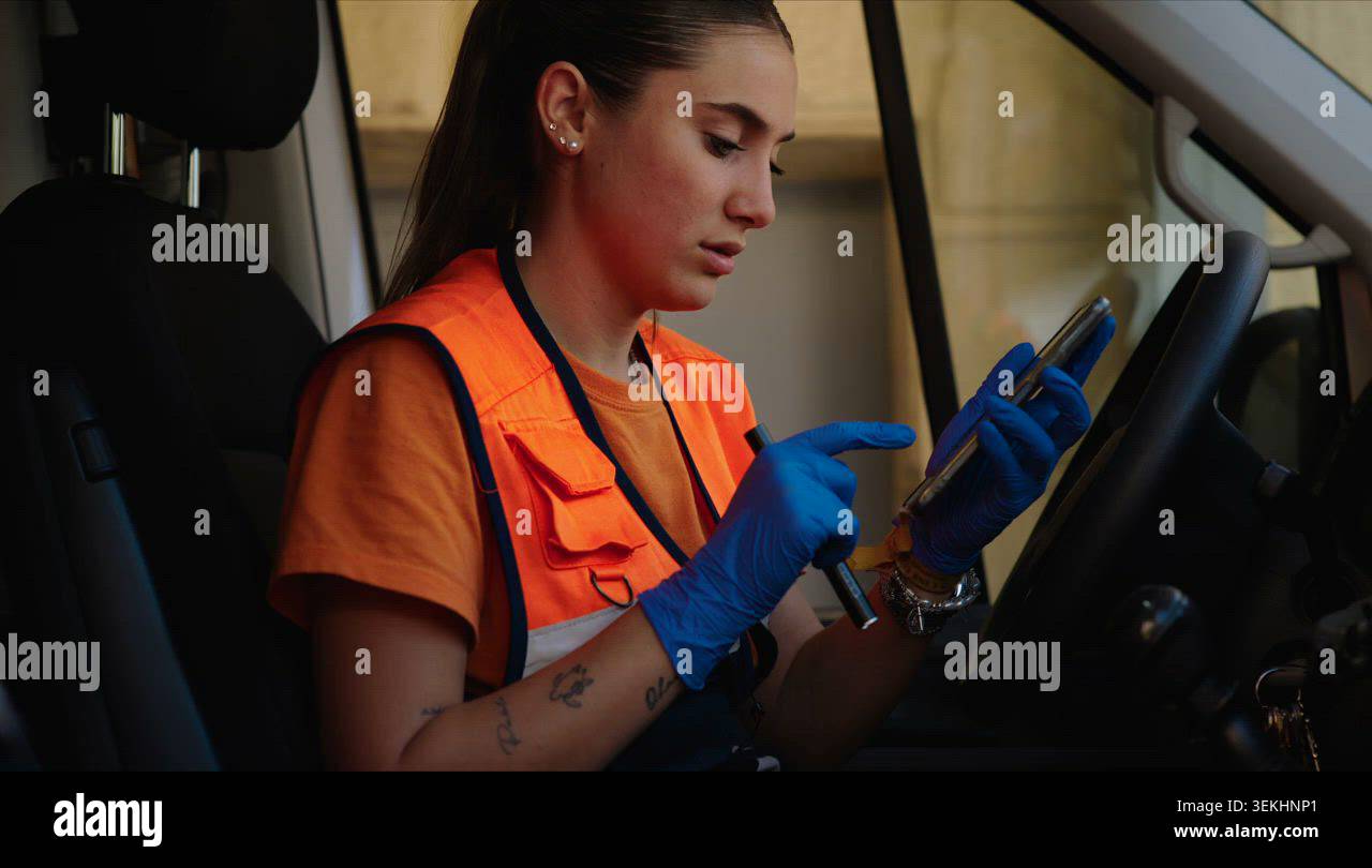 Female paramedic working in ambulance Stock Video Footage - Alamy