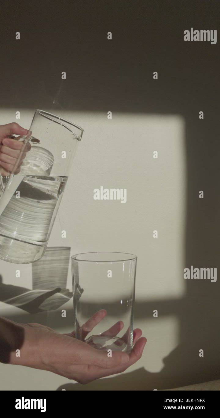 Pouring Water into Glass Cup Stock Video Footage - Alamy