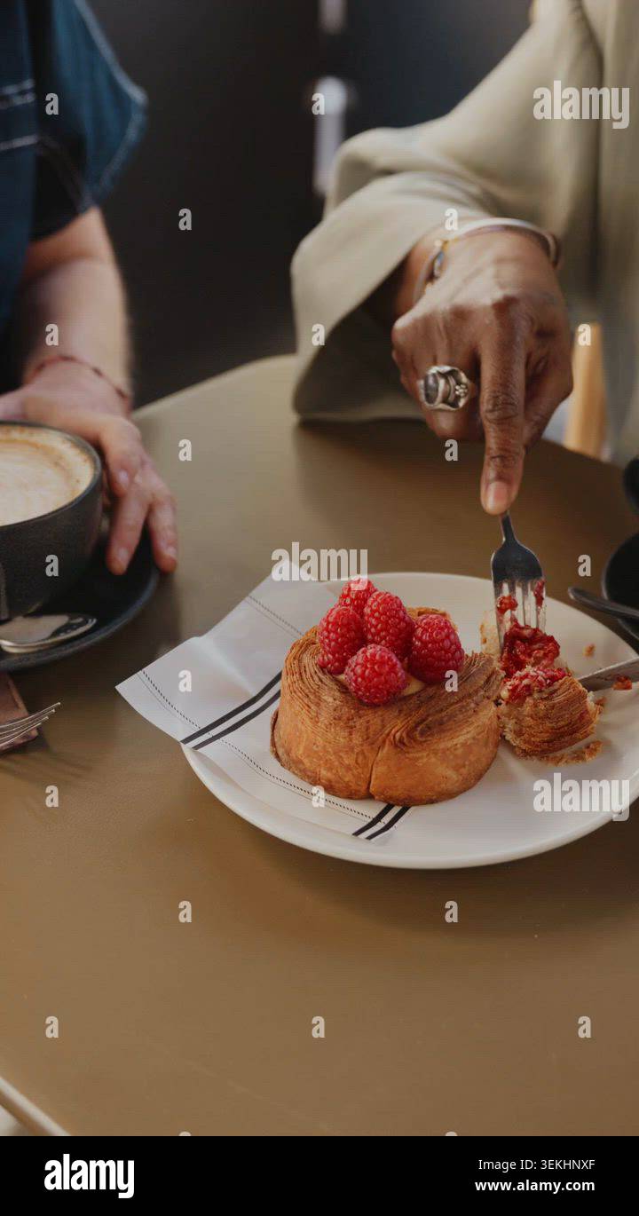 Anonymous friends having pastry and coffee Stock Video Footage - Alamy