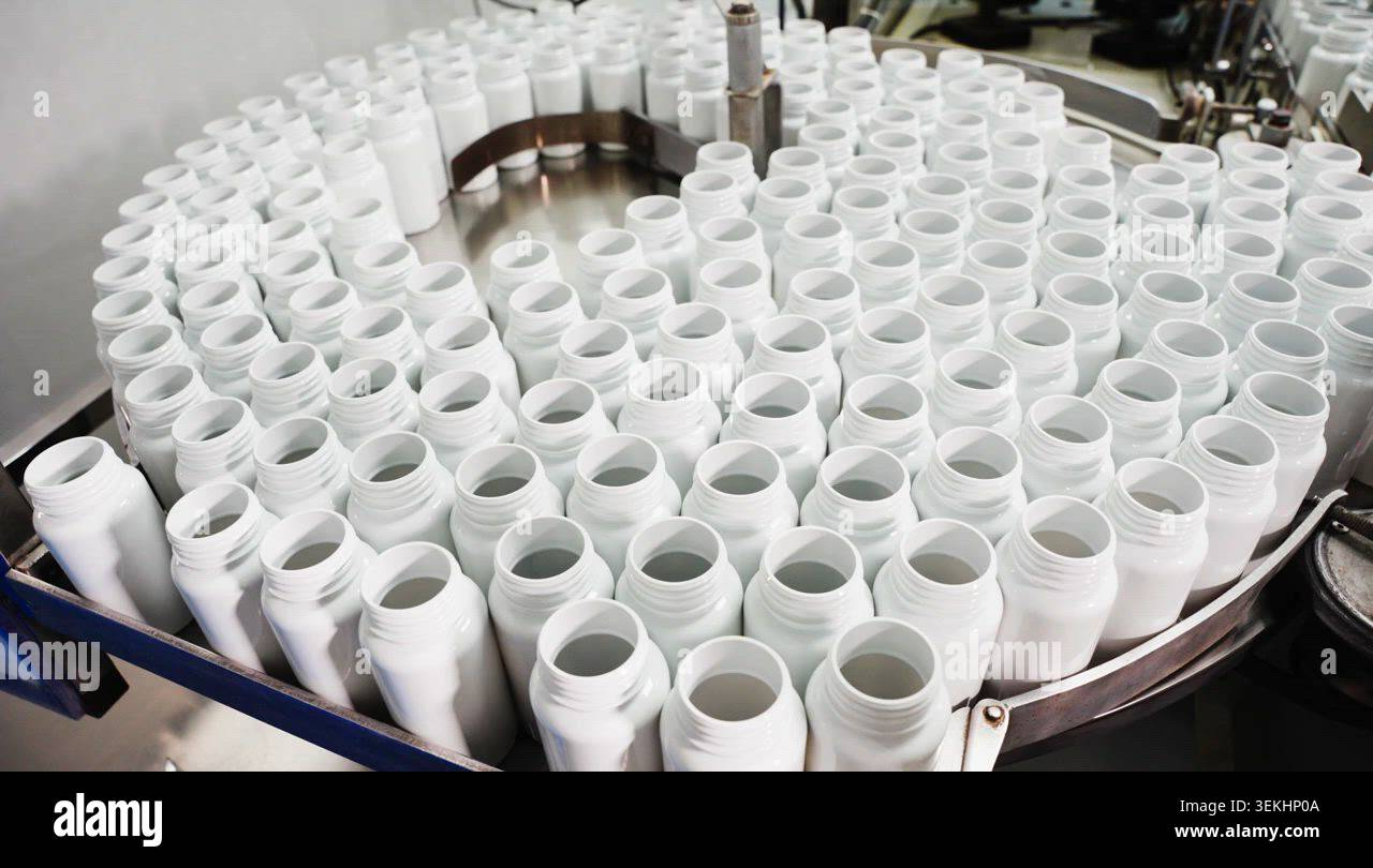 Pharmaceutical pill bottles moving on a conveyor belt Stock Video ...