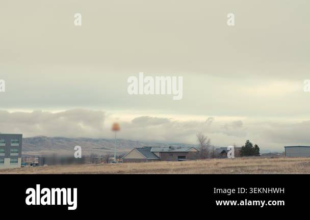 Mcdonalds sign stands against a backdrop of distant mountains on an ...