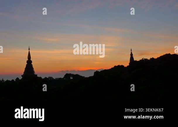 Scenic Sunset Between the Noppamethanedol and Nopphonphumsiri Pagodas ...