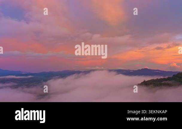 Aerial View of Dreamy Fog Beneath a Rainbow Colored Sky Stock Video ...