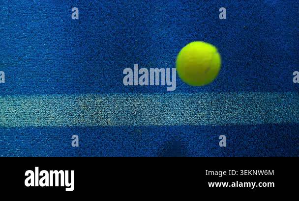Extreme super slow motion close-up of a tennis or padel ball bouncing ...