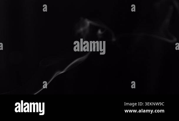 Detailed slow motion rising smoke isolated on black background ...