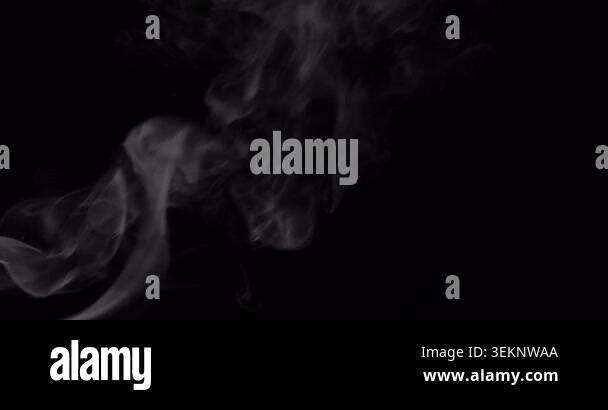 Detailed slow motion rising smoke isolated on black background ...