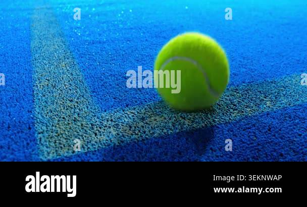 Extreme super slow motion close-up of a tennis or padel ball bouncing ...