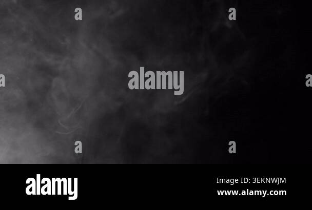 Detailed slow motion rising smoke isolated on black background ...