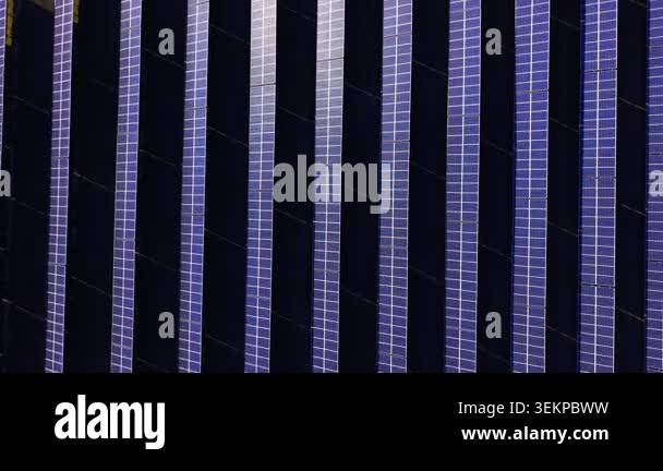 Close up pattern of vertical solar panel rows in sunlight. Aerial view ...
