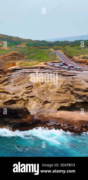 Aerial view of flat layered sandstone rock platform with visitors ...