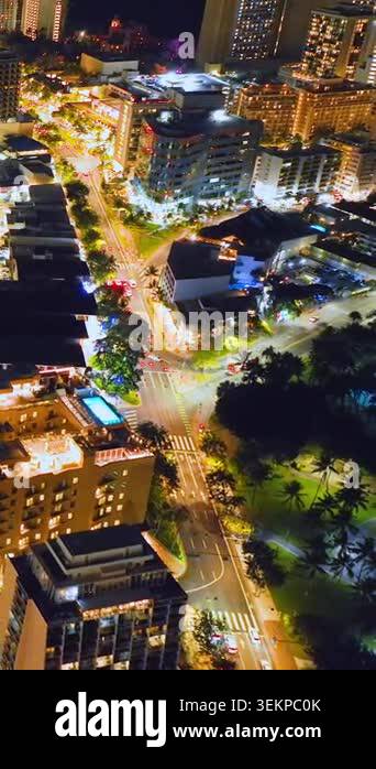 Aerial nighttime view of illuminated Honolulu street intersection with ...