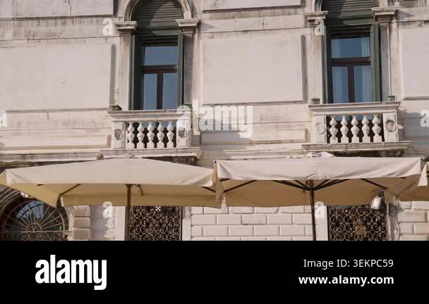 Venetian residential building facade with decorative balconies and ...