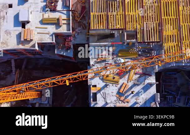 Bird's eye view capturing yellow wooden beams and steel reinforcements ...