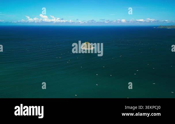 Aerial drone footage pushes toward Gili Selong Belanak, a small ...