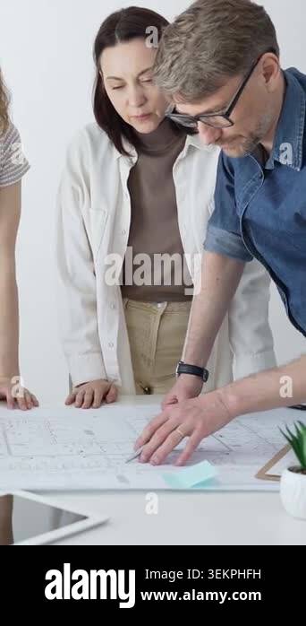 Architects and engineers collaborating on a new construction project ...