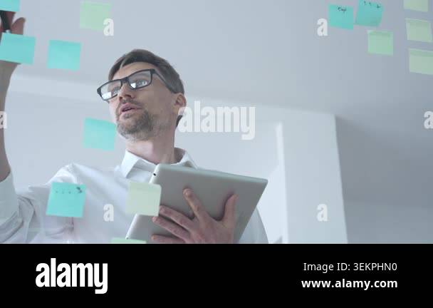 Professional businessman wearing eyeglasses brainstorming innovative ...