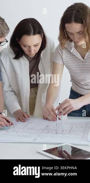 Architects and engineers collaborating on a new construction project ...
