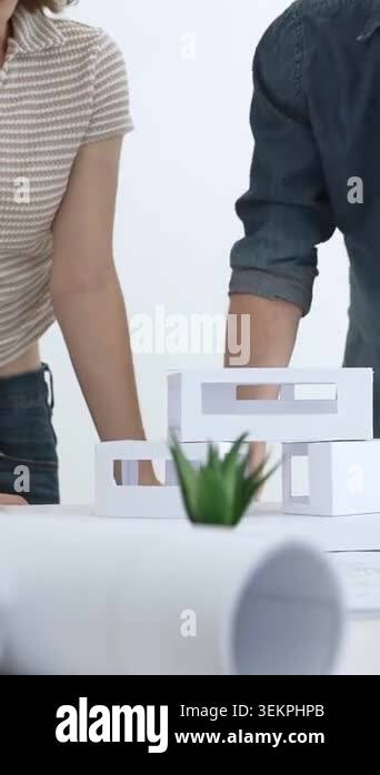 Architects collaborating on an innovative urban planning and building ...