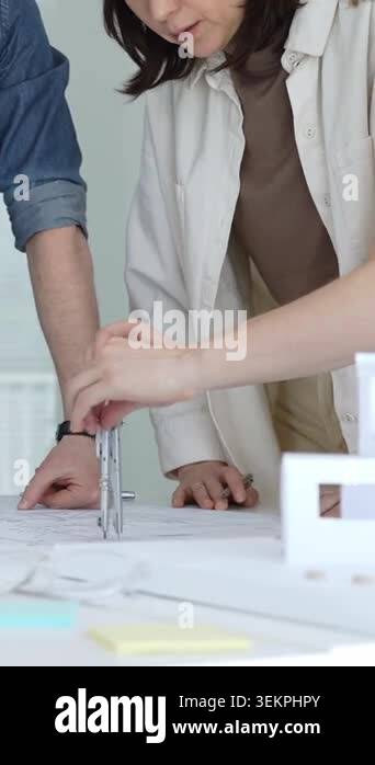 Architects and engineers collaborating on a new building project, using ...