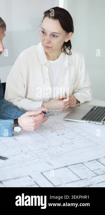 Architects developing a new building project, collaborating and ...