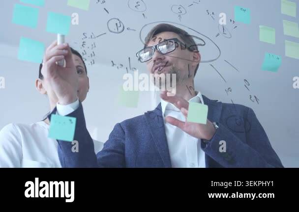 Businessman developing a strategic mind map for success on a ...