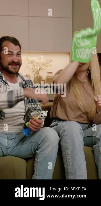 Caucasian woman with long hair engages with male friend using colorful ...