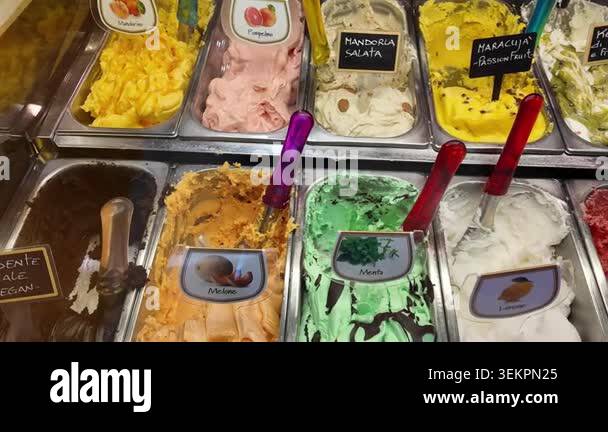 Close-up of ice cream assortment in a shop window. Pistachio, chocolate ...