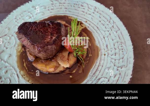 Exquisite beef fillet steak with rich dark sauce and mashed potatoes ...