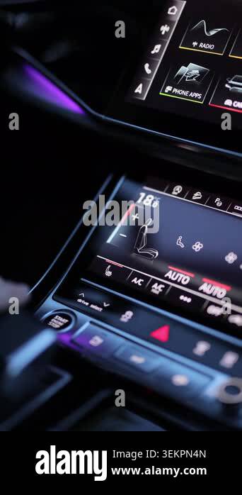 Vertical video of Man finger press heating button in the car. Pressing ...