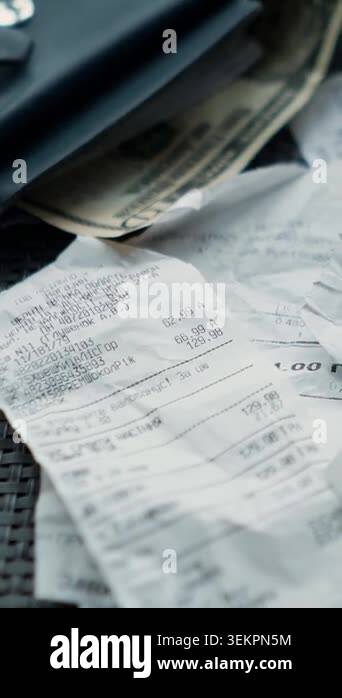 Close-up of invoices and receipts for goods from a store. Inflation and ...