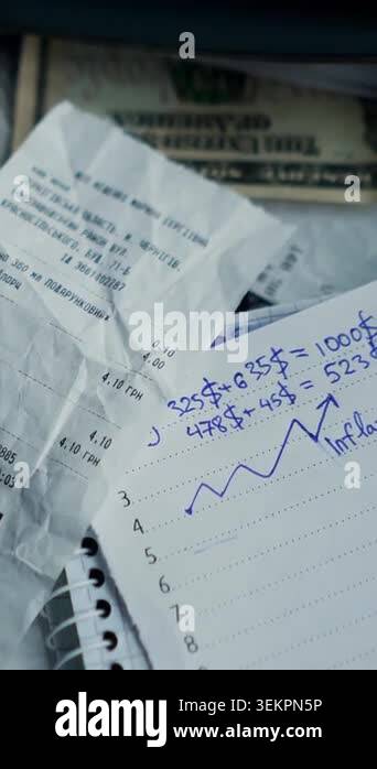 Close-up of invoices and receipts for goods from a store. Inflation and ...