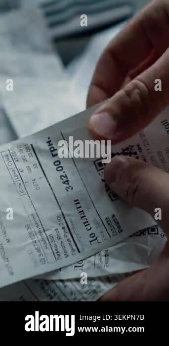 Close-up of invoices and receipts for goods from a store. Inflation and ...