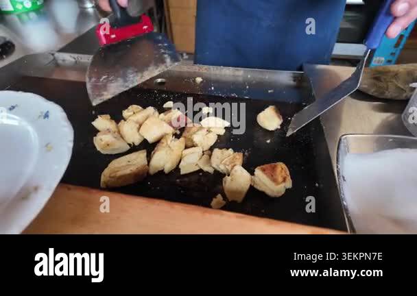 Professional chef hands chopping and frying sweet Kaiserschmarrn ...