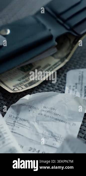 Close-up of invoices and receipts for goods from a store. Inflation and ...
