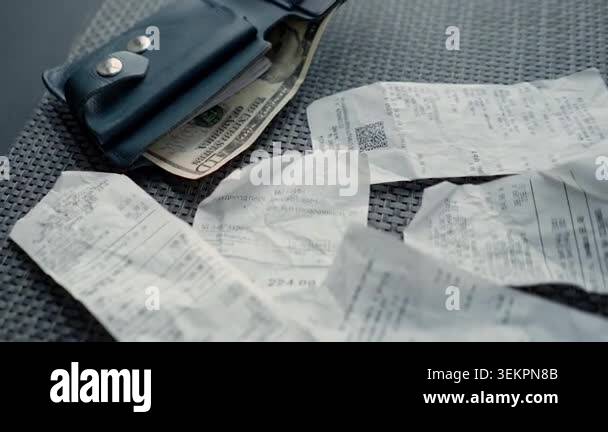 Close-up of invoices and receipts for goods from a store. Inflation and ...